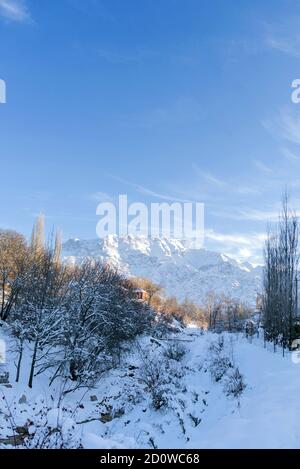 Winter snow-covered mountain Chimgan in Uzbekistan. Tien Shan mountains ...