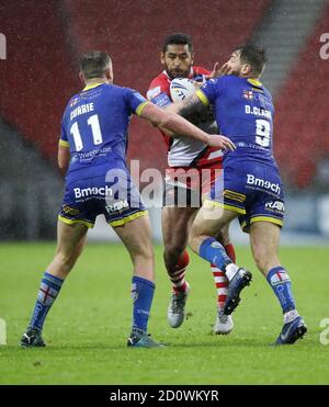 Daryl Clark of St. Helens is tackled during the Betfred Super League ...