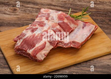 Raw pork ribs served rosemary for cooking Stock Photo - Alamy