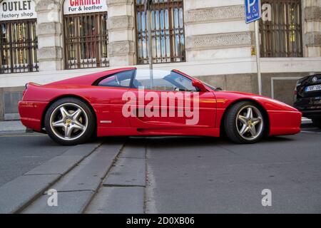 Red parked Ferrari F355 gts convertible in the famous red ferarri color ...