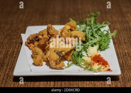 Japanese Ika Age Deep fried squid in a light crispy batter Stock Photo ...