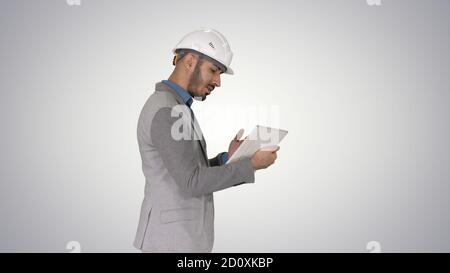 The hipster engineer making video call with tablet showing result of ...