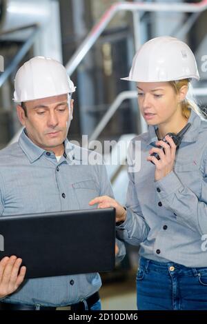 portrait of colleagues with factory plans Stock Photo - Alamy