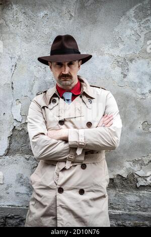Portrait of a detective with folded arms in a ghetto Stock Photo - Alamy