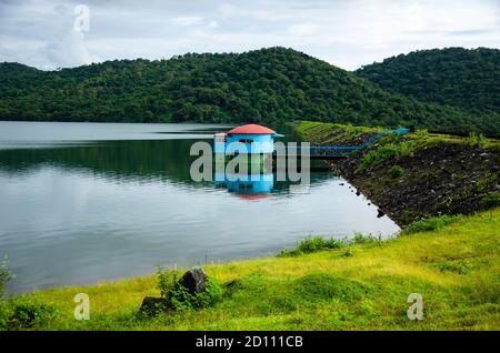 Serene view of Chapoli dam reservoir during monsoon season in Canacona ...