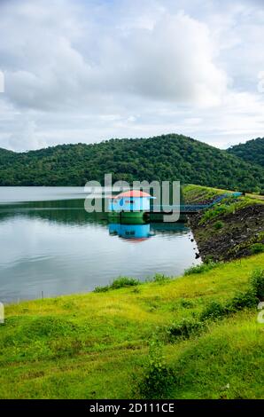 Serene view of Chapoli dam reservoir during monsoon season in Canacona ...