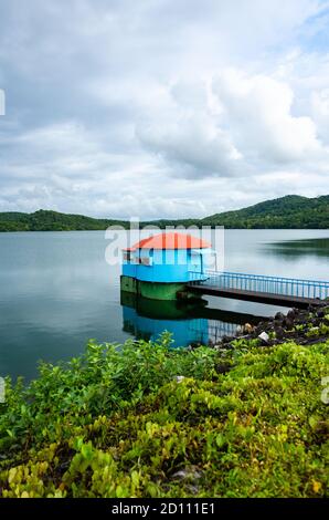 Serene view of Chapoli dam reservoir during monsoon season in Canacona ...