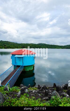 Serene view of Chapoli dam reservoir during monsoon season in Canacona ...