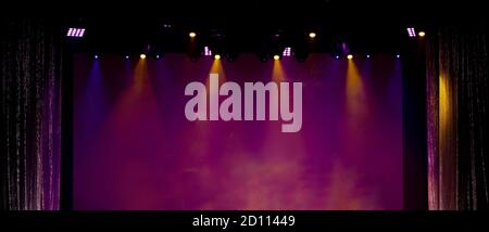 Theater before the performance of artists. Bright colored light and ...