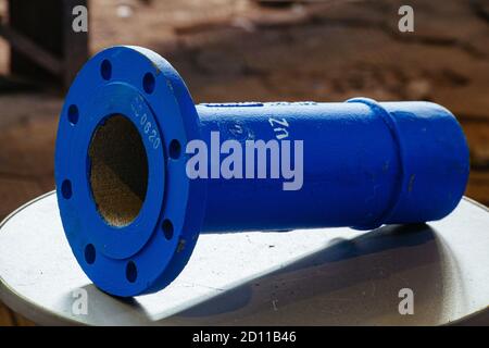Cast metal pipe connection with flange and tools Stock Photo - Alamy
