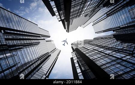 Airplane plying in business district area, skyscrapers - 3D ...
