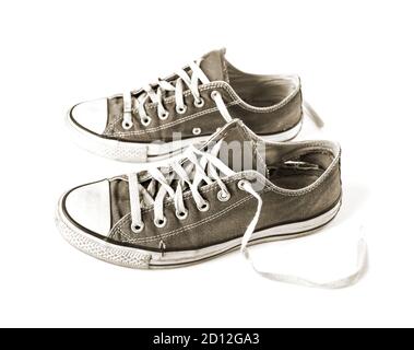Old black generic sneakers isolated on white background. Old black ...