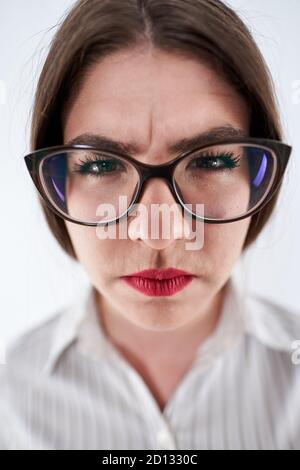 Wide angle closeup of a young businesswoman frowning in anger Stock ...