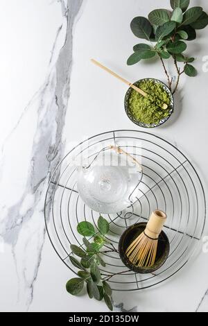 Ingredients for making matcha drink. Green tea matcha powder in ceramic ...