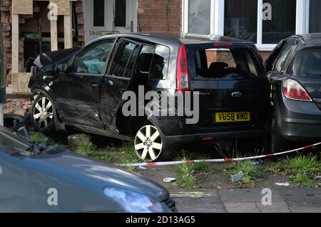 The remains of a Ford Fusion after a 15-year old crashed the car into a ...