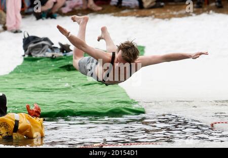 man jumping a ice hole in Jammu and Kashmir , India Stock Photo - Alamy