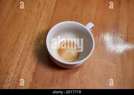 Running out of coffee, empty cup Stock Photo - Alamy