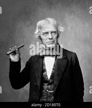 Portrait of Michael Faraday with glass bar. Circa 1850. Photograph by ...