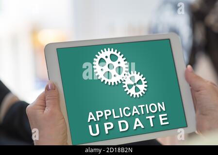 Tablet screen displaying an application update concept Stock Photo - Alamy