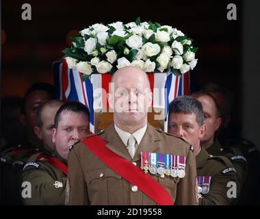 The coffin of Lieutenant Colonel Rupert Thorneloe is carried out of the ...