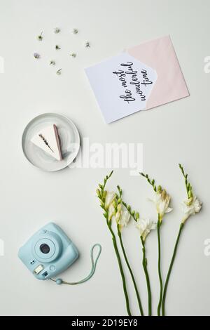 Minimal background with blank paper, camera, glasses, and magnifier ...