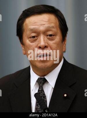 Newly appointed Defense Minister Yasukazu Hamada, left, arrives at the ...
