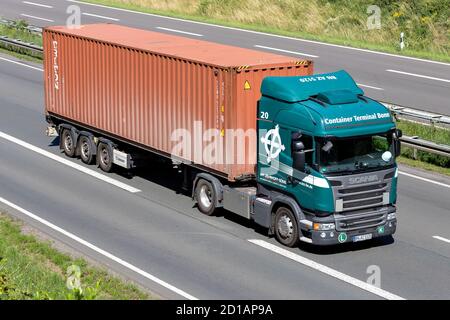 truck with Triton container on motorway. Triton International Limited ...