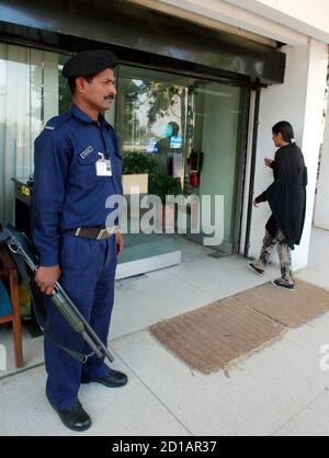 Pakistan, Islamabad, Security guard at one of Islamabad's shopping Mall ...