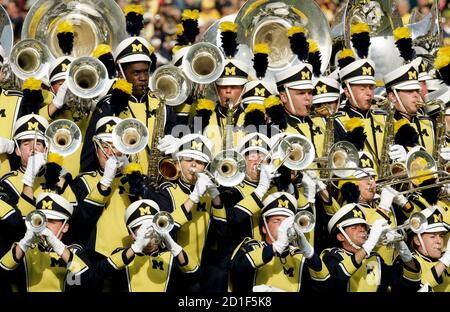 University of Michigan marching band horn players under sunny, blue ...