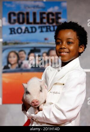 Eshaya Draper and Albert the pig Premiere of 'College Road Trip' held ...