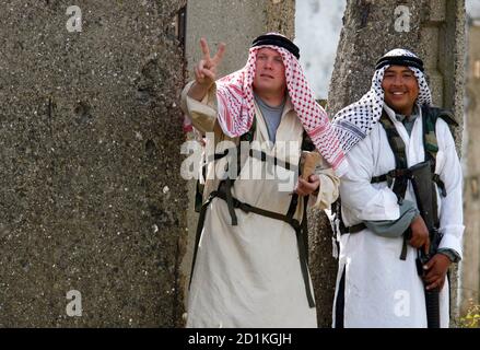 Soldiers with the 5th Battalion 7th Air Defense Artillery Regiment get ...