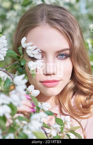 Spring blossoming tree. Happy spring day. Girl enjoy sakura bloom in ...