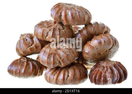 Heap of freshly baked brown eclairs isolated on a white background ...