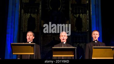 Three practising Roman Catholic priests (left-right) Fathers Martin O ...