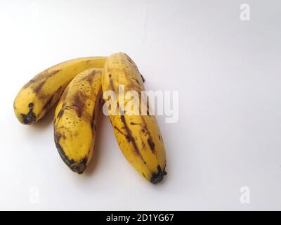 Closeup shot of bananas going bad on white background Stock Photo - Alamy