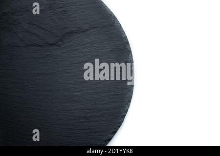 Empty black round slate serving board on white background with rustic ...