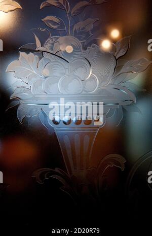 Etched glass Pub window at night, London Stock Photo - Alamy