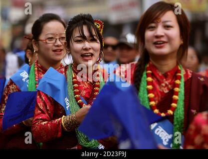 A Nepalese Gurung community woman in a traditional attire gets ready to ...