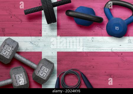 Denmark gym concept. Top view of heavy weight plates with iron bar on ...