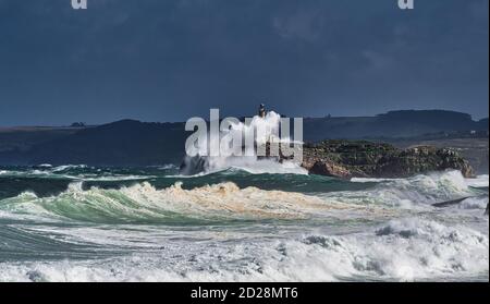 The Mouro island lighthouse during a storm. Big waves, more of 10 ...