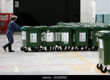 Row of clothing recycling bins in an Asda supermarket car park Stock ...