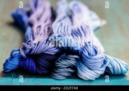 close-up shades of blue embrodery thread, still-life Stock Photo - Alamy
