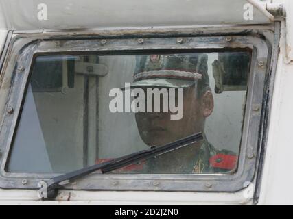 Armed police officer at main entrance gates to the Balmoral Estate ...