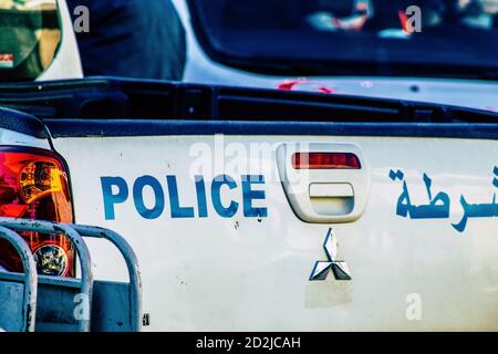 Closeup of an official police car patrolling the streets of the city ...