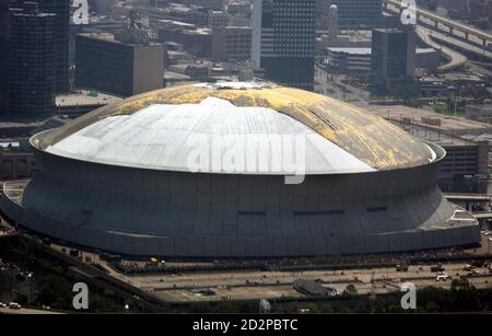 The roof of the New Orleans Superdome was damaged by Hurricane Katrina ...
