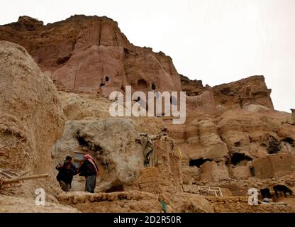 AFGHANISTAN Bamiyan Province Caves in cliffs near empty niche where the ...