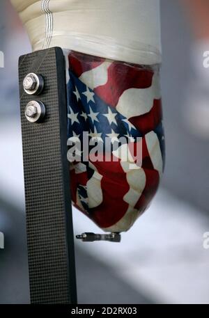 U.S. Army Maj. David Rozelle puts on a specialized prosthetic leg ...
