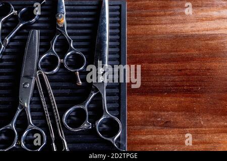 Vintage scissors on black wooden background Stock Photo - Alamy