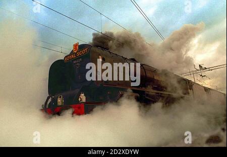 The Royal train hauled by a steam engine stands in Llanfair PG station ...