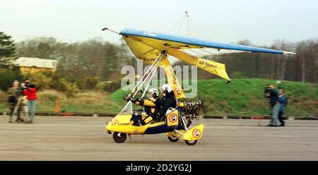Pilots Brian Milton (front) and Keith Reynolds prepare for take-off in ...